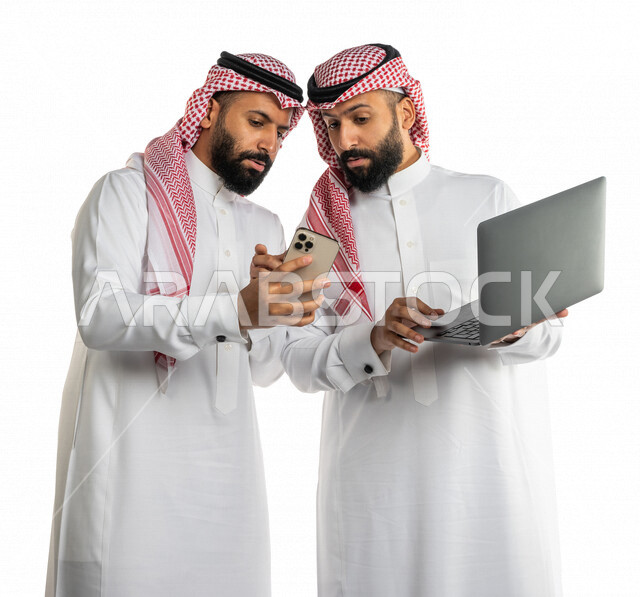 Portrait of two Saudi Arabian Gulf twin men, meeting of co-workers at ...