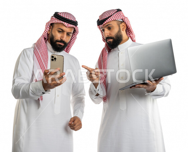Portrait of two Saudi Arabian Gulf twin men, meeting of co-workers at ...