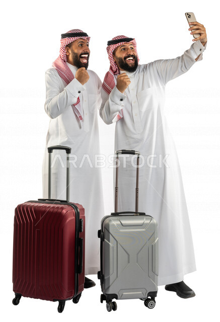 Portrait of two Saudi Arabian Gulf twin men in front of them with the ...