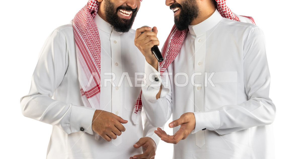 Portrait of two Saudi Arabian Gulf twin men enjoying singing, singing ...