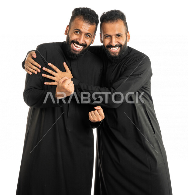 Portrait of two Saudi Arabian Gulf twin men, interconnected brotherly ...