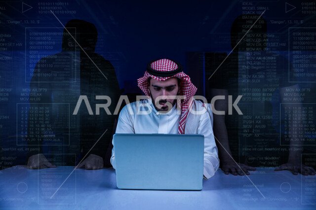 A Saudi Arabian Gulf man working as a web developer, using programming ...
