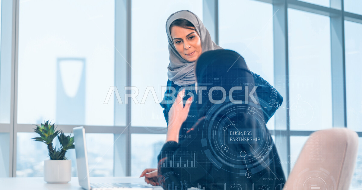 Two Saudi Arabian Gulf women in the work office, work meeting, task ...