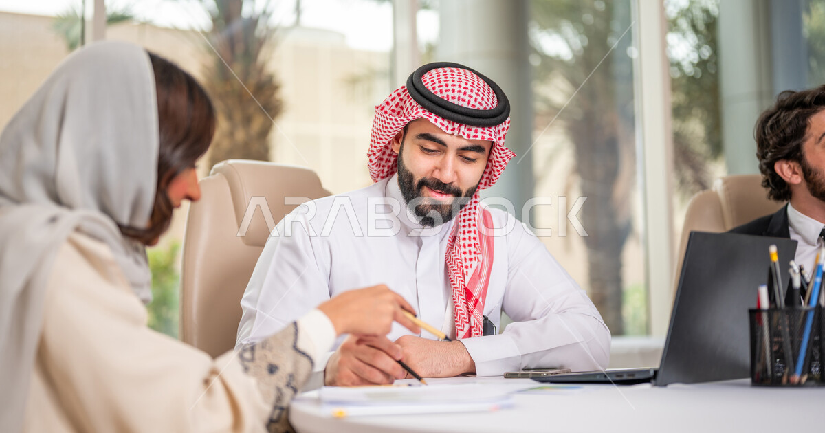 A Saudi Arabian Gulf team in a business meeting with a new client ...