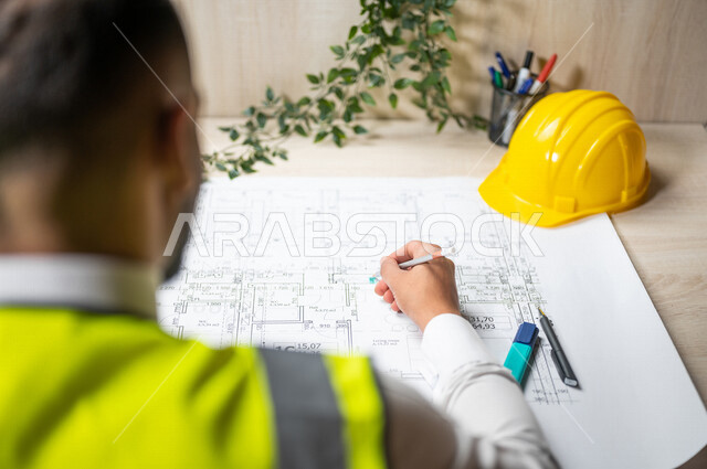 A close-up image from the back of a Saudi Arabian Gulf engineer inside ...