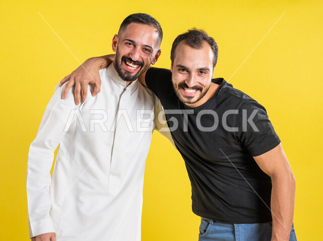 Portrait of two Saudi Arabian Gulf men, interconnected brotherly ...