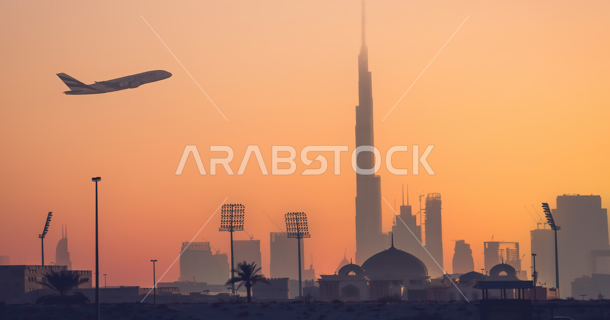 A picture of a plane flying in the sky of the United Arab Emirates at ...