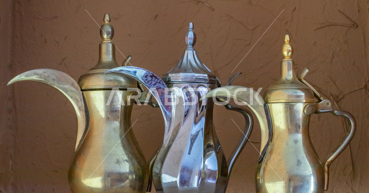 A group of ancient oriental Arab coffee pots and utensils made of ...