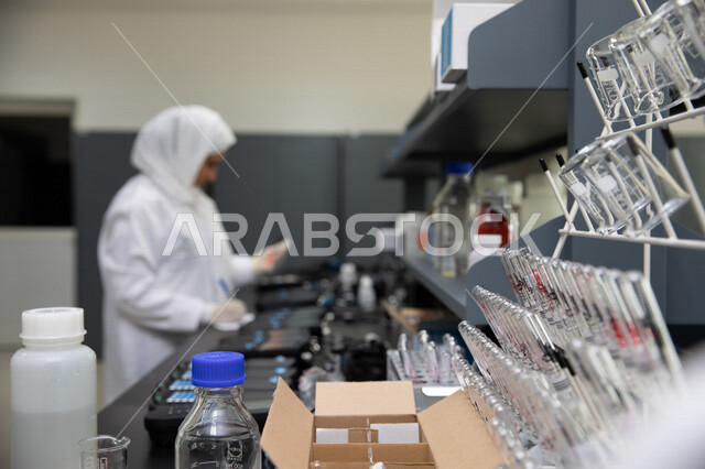 A Saudi Arabian Gulf woman working in the laboratory, medical tests ...