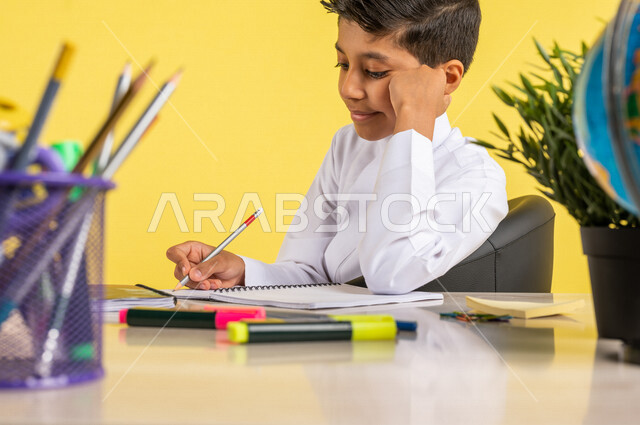 Portrait of a Saudi Arabian Gulf student, wearing traditional Saudi ...