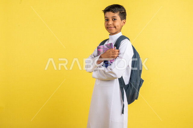 Portrait of a Saudi Arabian Gulf student, wearing traditional Saudi ...