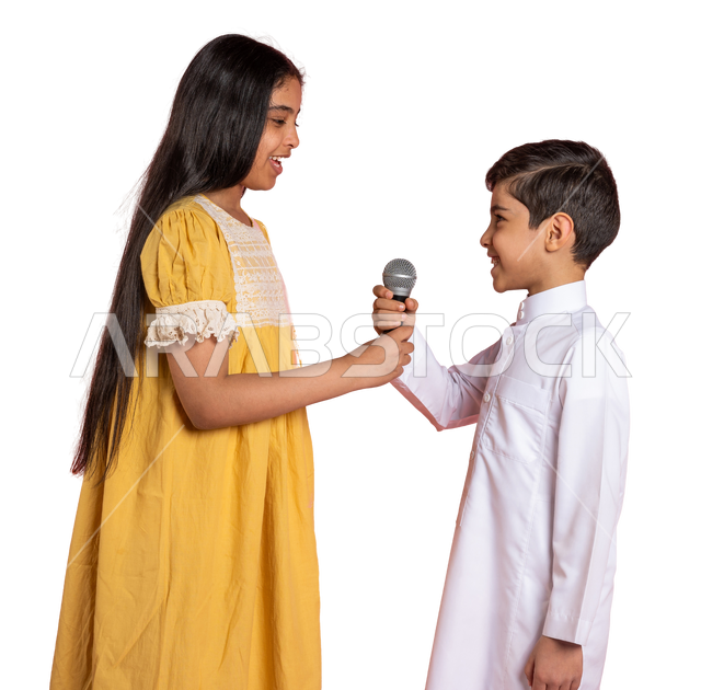 Portrait of two Saudi Arabian Gulf children holding a microphone, voice ...
