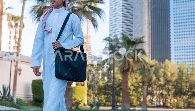 Close-up of a Saudi Arabian Gulf university student wearing traditional ...