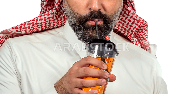 Close-up portrait of a Saudi Arabian Gulf man, wearing traditional ...
