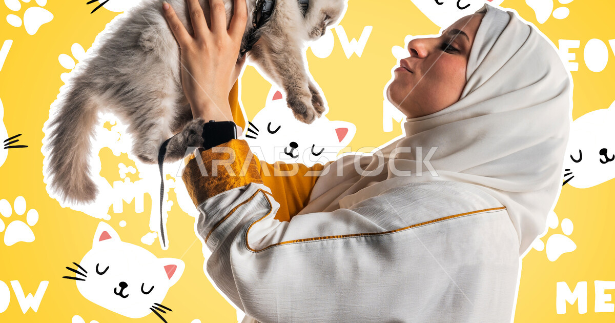 Portrait of a Saudi Arabian Gulf woman with her pet, fun and playing ...