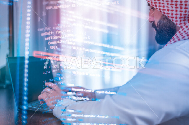A Saudi Arabian Gulf man working as a web developer, using programming ...