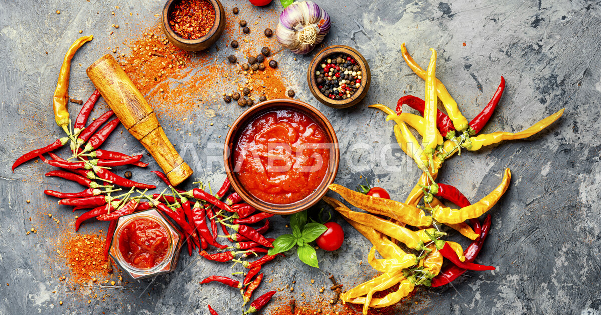 Close-up of a group of spices and hot peppers of all kinds, traditional ...