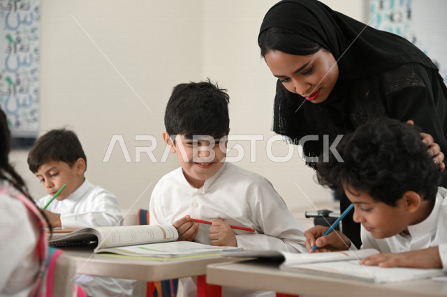 A Saudi Arabian Gulf teacher who monitors male and female students and ...