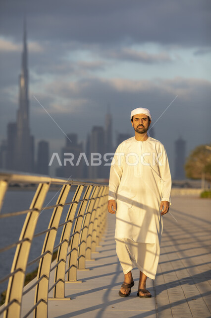 Emirati Gulf Arab man, in traditional Emirati dress, blurry background ...