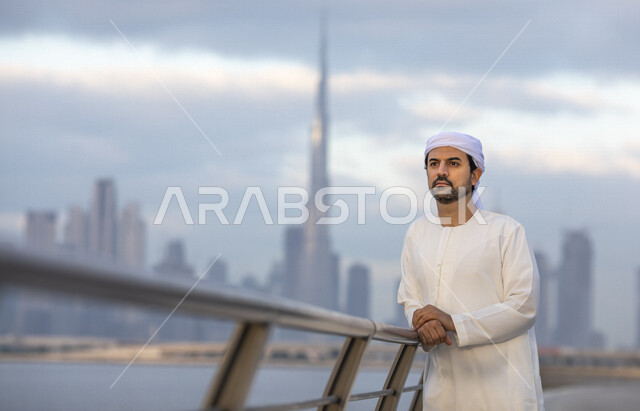 Emirati Gulf Arab man, in traditional Emirati dress, blurry background ...