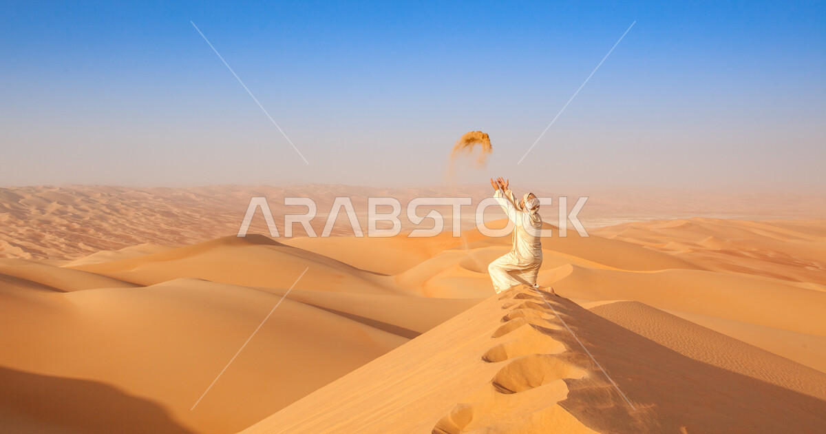 Emirati Gulf Arab man in desert areas, desert environment, sand dunes ...