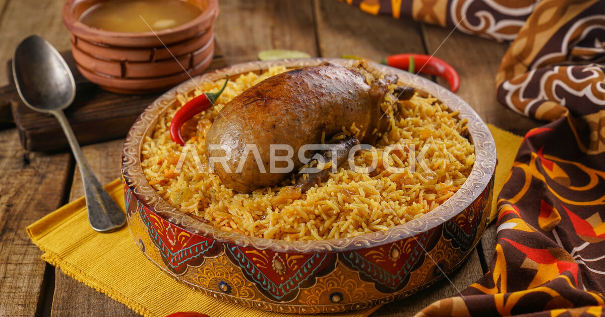 A plate of rice with stuffed pigeons, kabsa with pigeons, Saudi Arabian ...