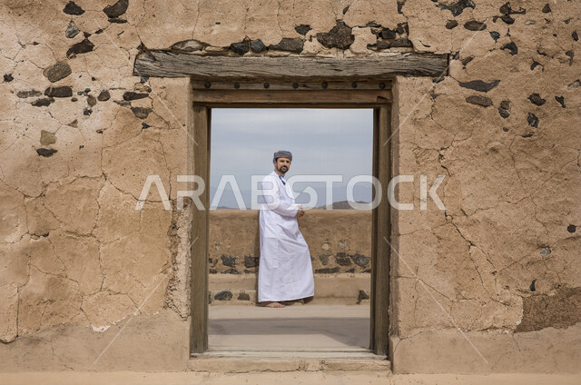 An Omani Gulf Arab man wandering in the Jibreen Castle, a tourist trip ...