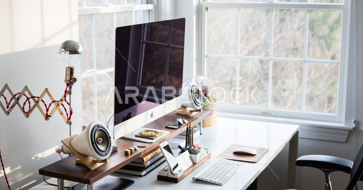 A group of modern technical devices on the office table, the ...