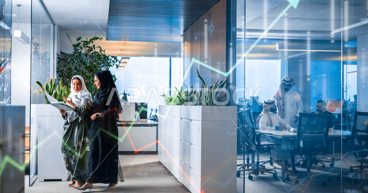 Two Saudi Arabian Gulf businesswomen in a business meeting inside the ...