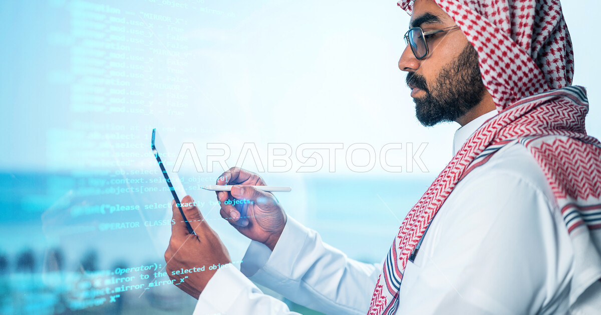 A Saudi Arabian Gulf man in traditional dress inside the company's ...