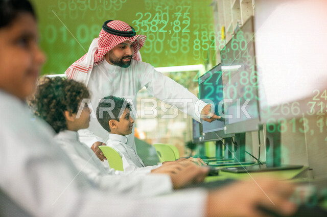 A Saudi Arabian Gulf teacher is explaining to students in the classroom ...