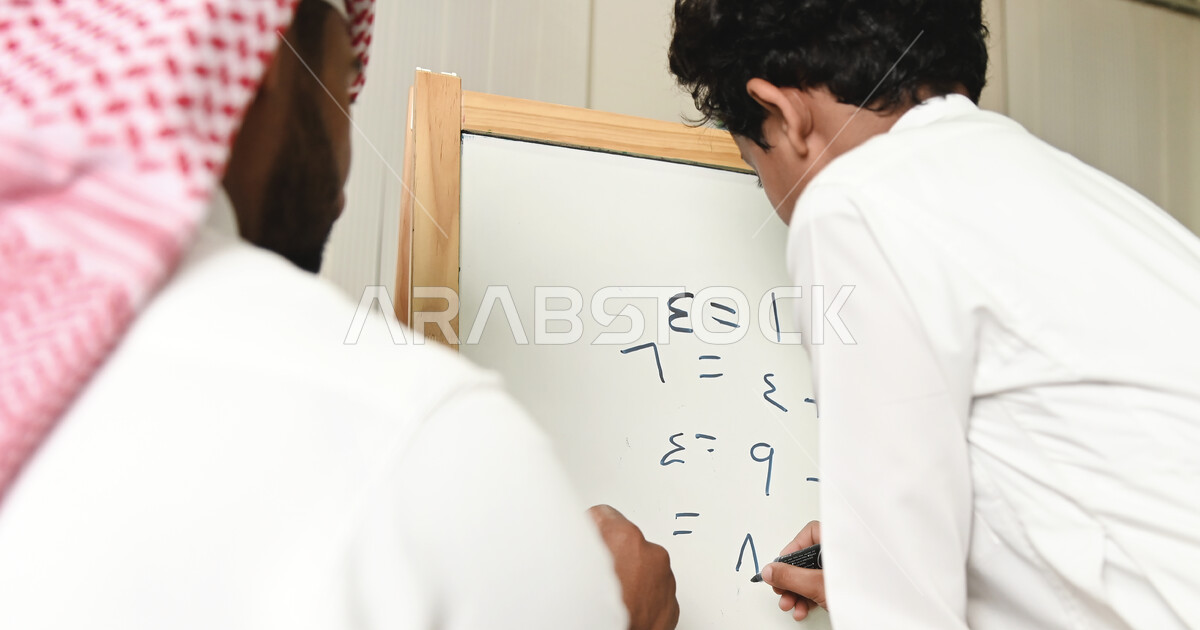 A Saudi Arabian Gulf mathematics teacher explaining simple math ...