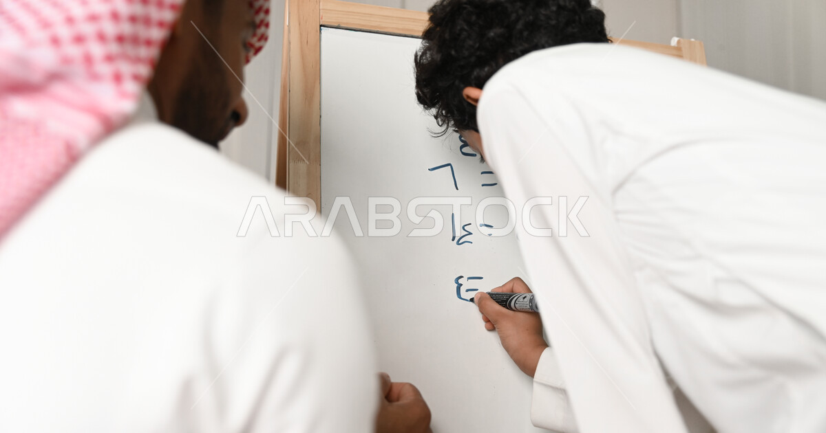 A Saudi Arabian Gulf mathematics teacher explaining simple math ...