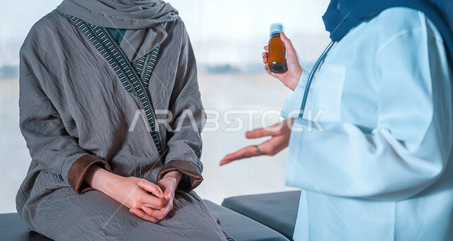 A Saudi Arabian Gulf doctor wearing a medical coat and a stethoscope ...