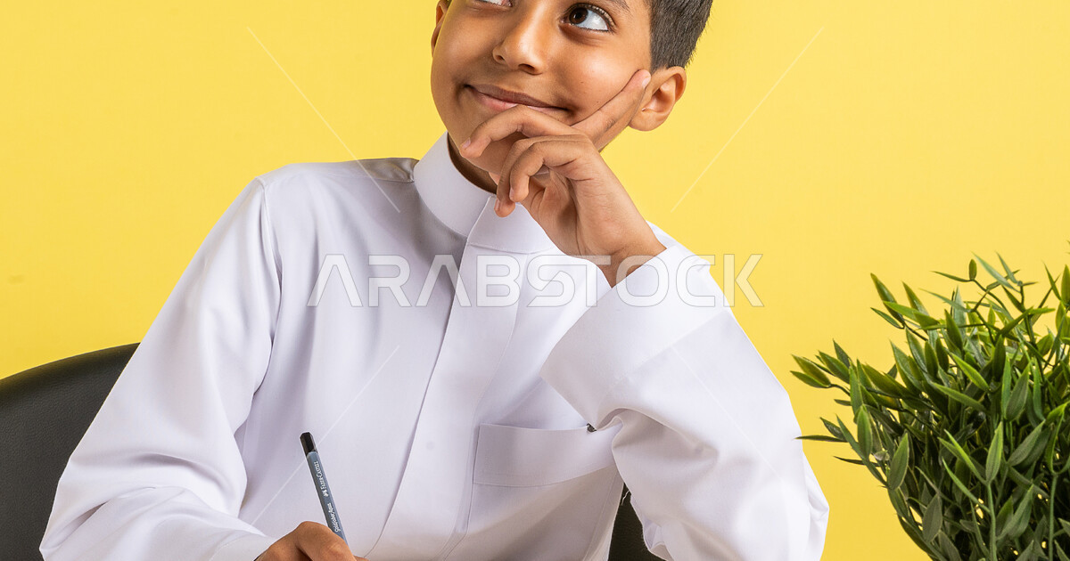 Portrait of a Saudi Arabian Gulf student wearing school uniform, school ...