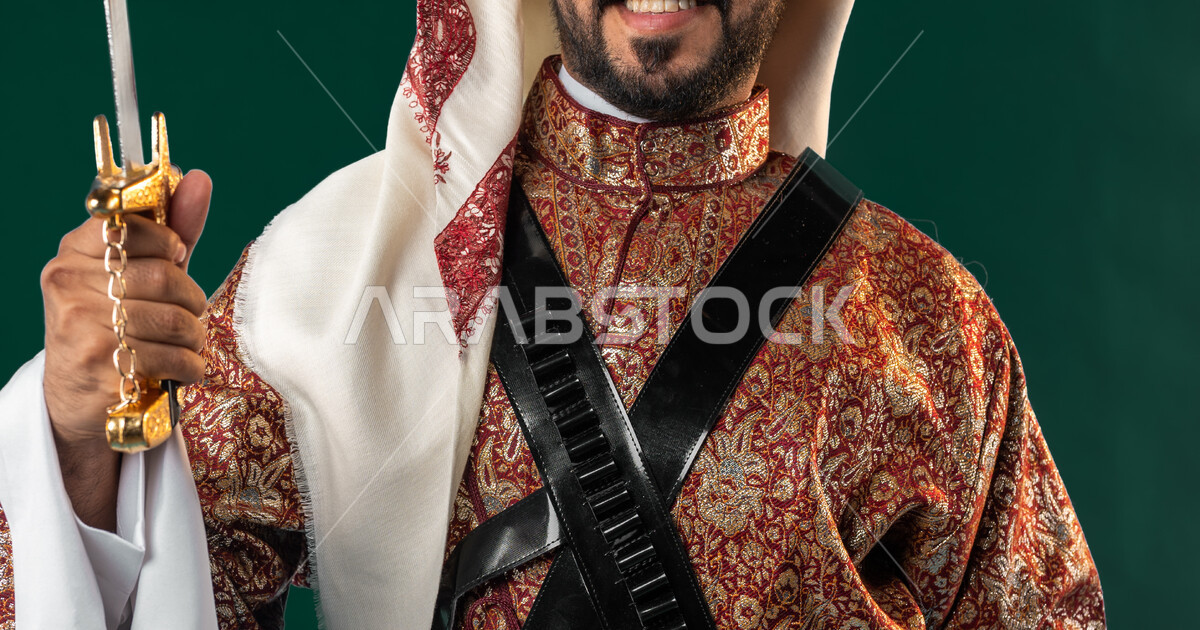 A chroma of a Saudi Arabian Gulf man, holding a sword in his hand ...