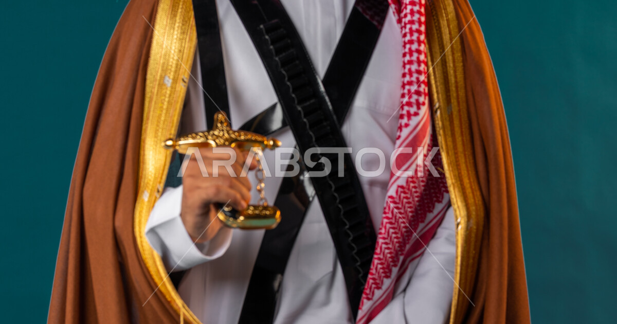 Chroma of a Saudi Arabian Gulf man wearing the Saudi bisht and holding ...