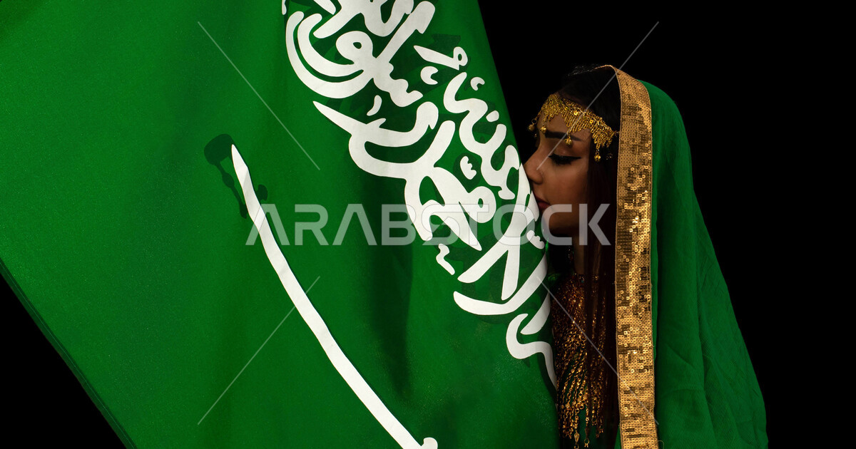 Portrait from the side of a Saudi Arabian Gulf woman accepting the ...