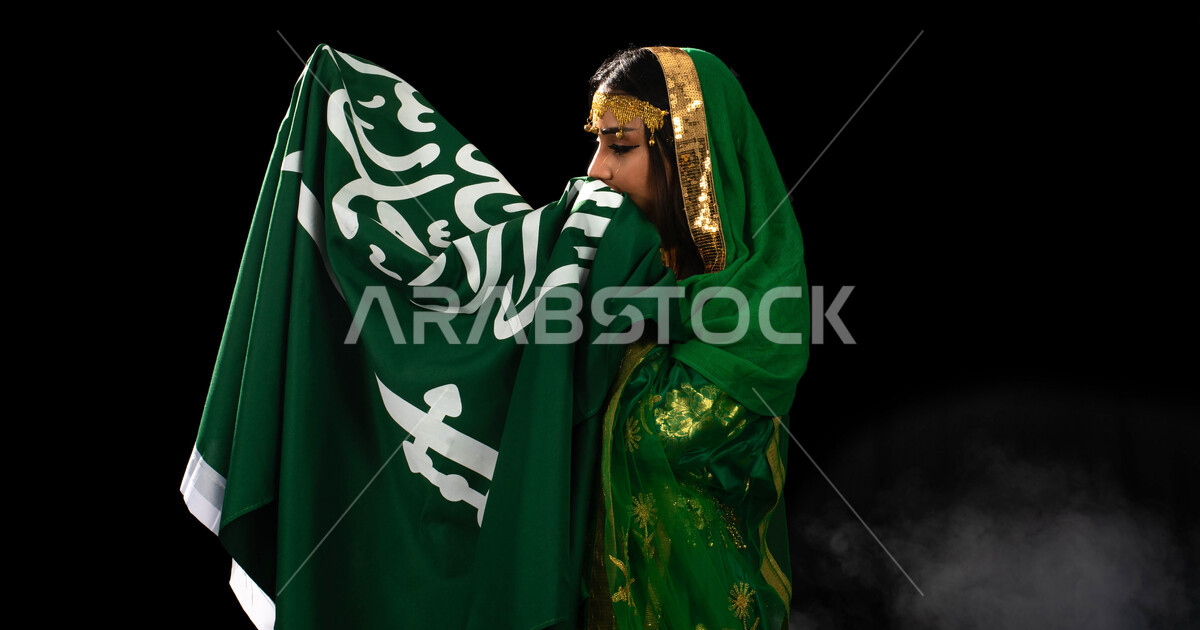 Portrait from the side of a Saudi Arabian Gulf woman accepting the ...