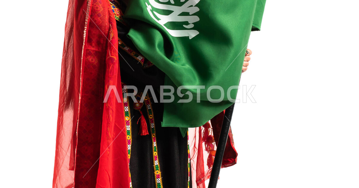 Portrait of a Saudi Arabian Gulf woman accepting the Saudi flag ...