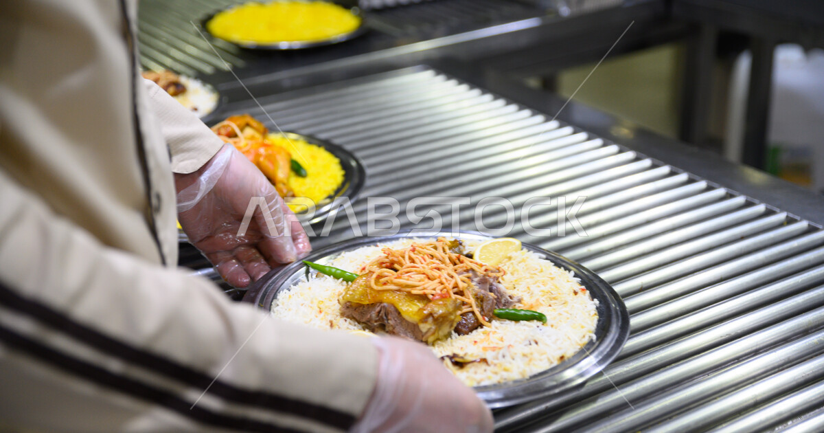 Traditional Saudi Arabian and Gulf foods ready to be served, preparing ...