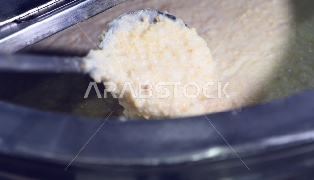 Saudi kitchen preparing white groats, cooking groats with chicken ...