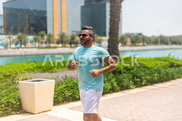 A Saudi Arabian Gulf man practicing morning sports on the Jeddah ...