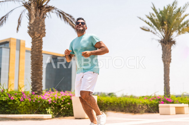 A Saudi Arabian Gulf man practicing morning sports on the Jeddah ...