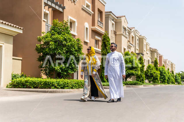 A Saudi Arabian Gulf couple wandering in the prestigious residential ...