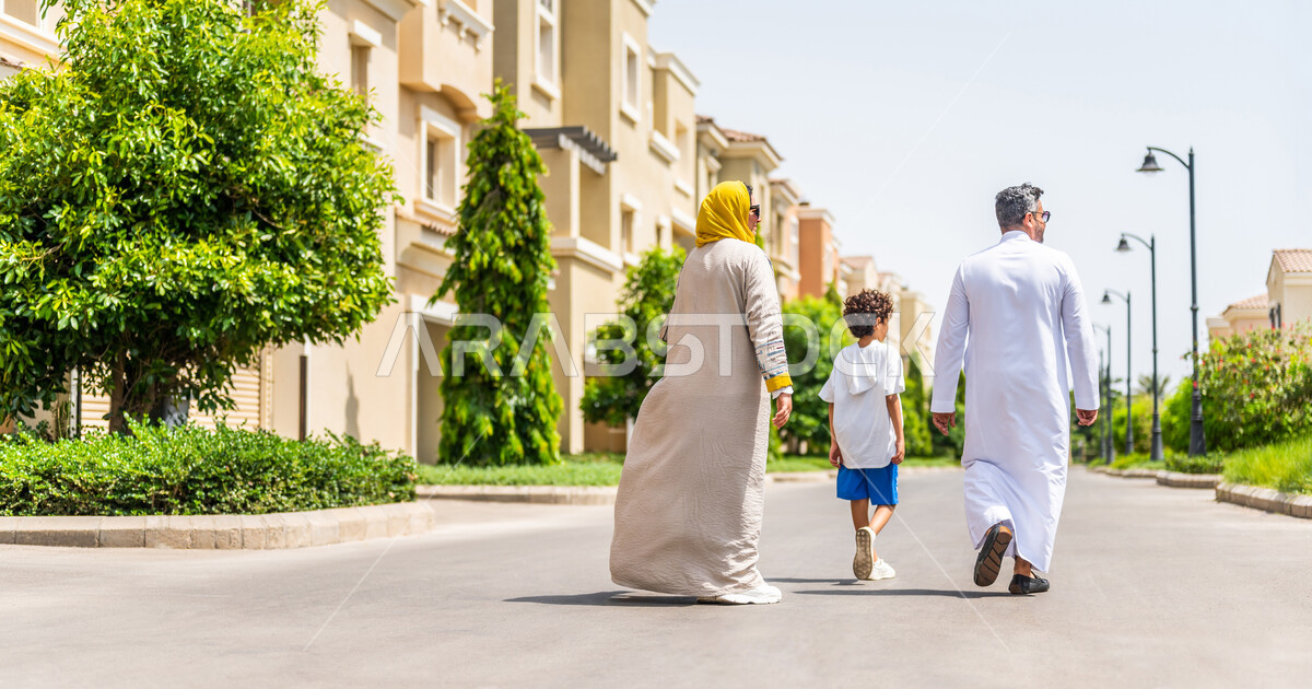 A corner from the back of a Saudi Arabian Gulf family wandering in the ...