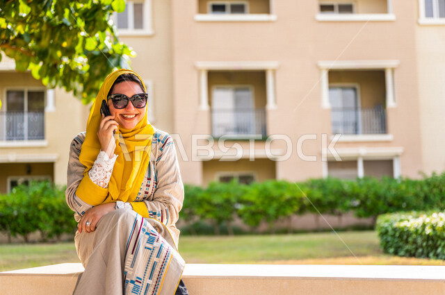 Close-up of a veiled Saudi Arabian Gulf woman, wearing a Gulf abaya and ...