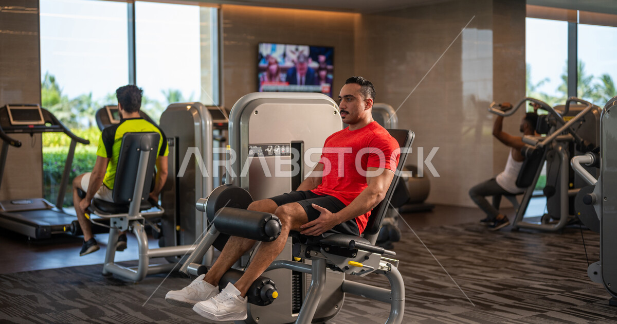 A group of young Saudi Arabian Gulf men wearing sports clothes in the ...