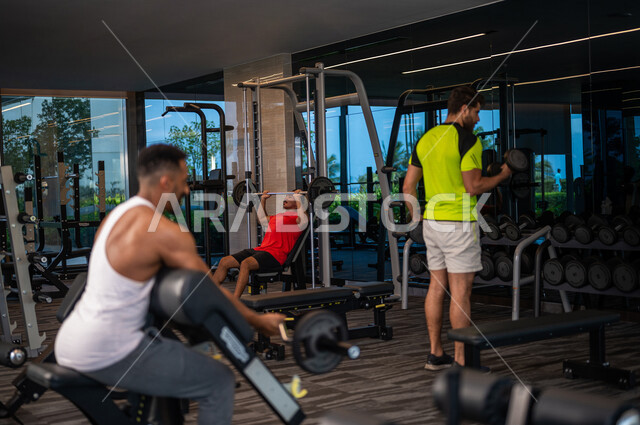 A group of young Saudi Arabian Gulf men wearing sports clothes in the ...