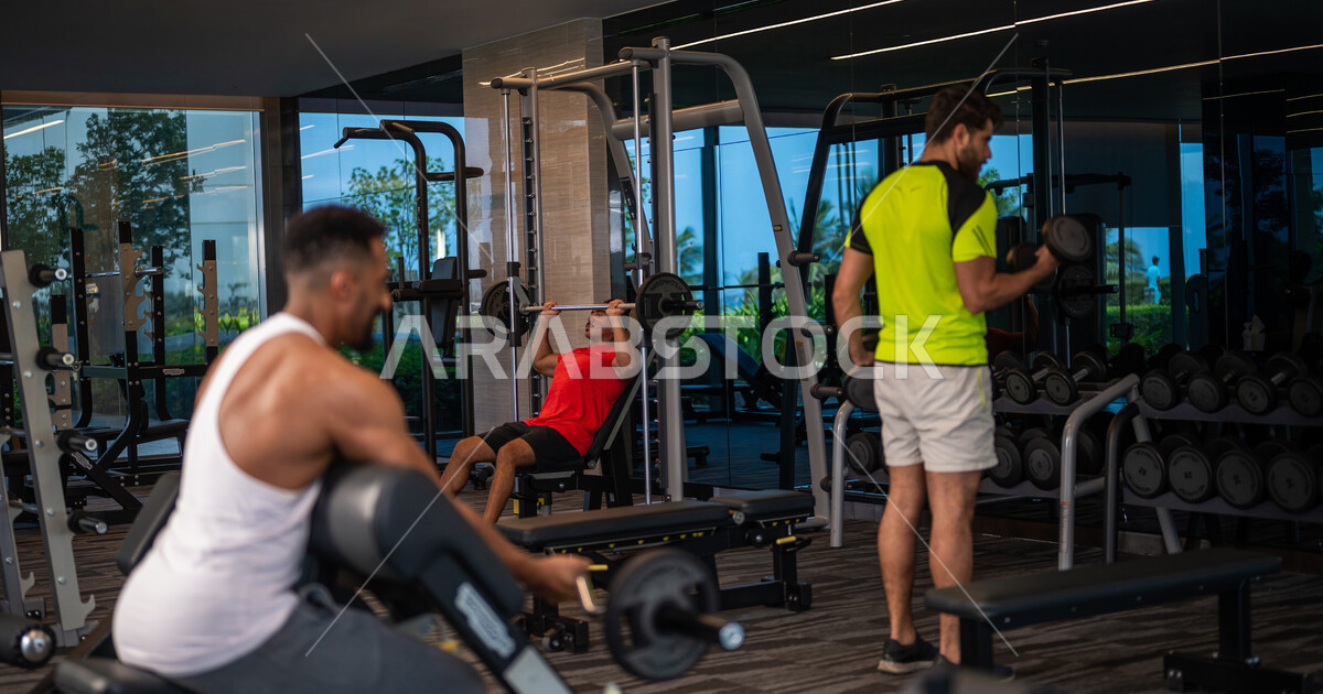 A group of young Saudi Arabian Gulf men wearing sports clothes in the ...